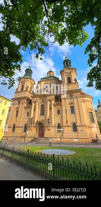 Prague, Czechia, May 5, 2026: Visitors stroll around St. Nicholas ...