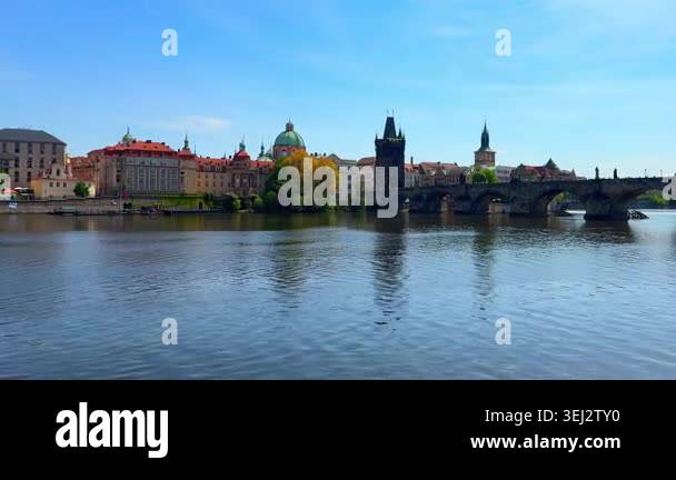The Vltava River in Prague. The Charles Bridge stands tall in the ...