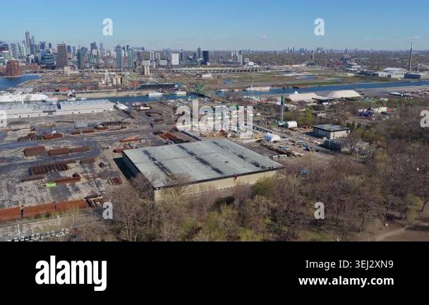 Industrial construction site at Port Lands with Torontos urban skyline ...