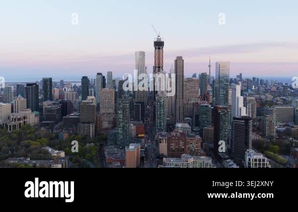 Cinematic descending movement towards Torontos downtown skyline with ...