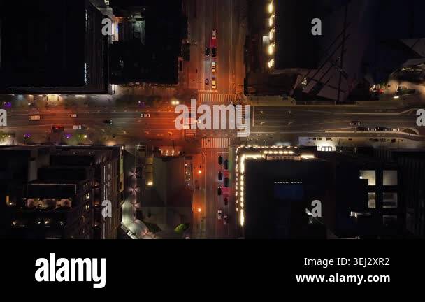 Top down showing downtown Torontos glowing intersection at night, cars ...