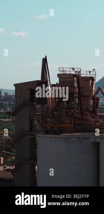 Old and rusty abandoned factory with its industrial machinery under a ...