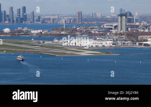 Ferry arriving at Billy Bishop Toronto City Airport with aircraft ...