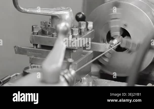 Industrial metalworking lathe machining metal component in factory ...