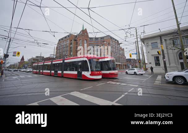 Urban public transit system showing a modern Toronto streetcar turning ...