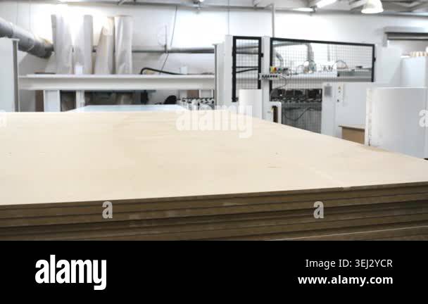 Stack of wooden furniture panels in industrial production facility ...