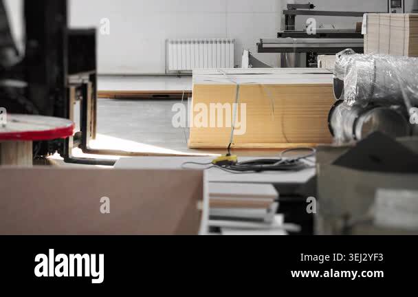 Forklift approaching ventilation pipes in an industrial warehouse ...