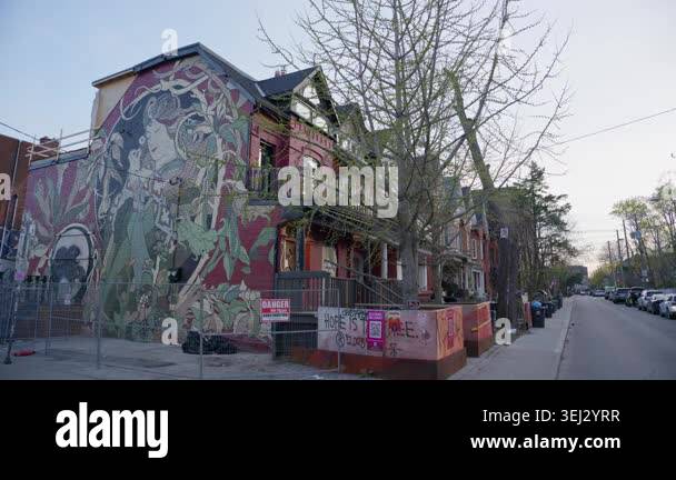 Urban graffiti mural showcasing street art on residential building in ...