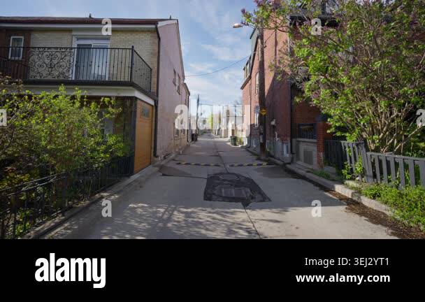 Urban landscape showcasing residential back alleyway with typical North ...
