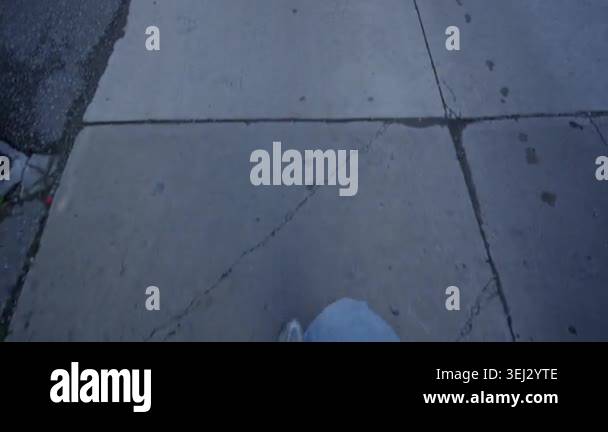 Person walking in first person through North American city alleyway ...