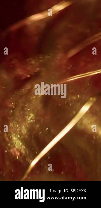 Vertical video. Glitter splash. Visual light. Defocused golden green ...