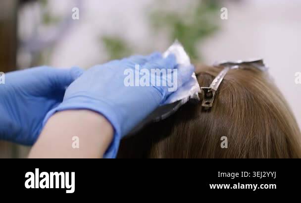 Hairstylist service. Hair foil. Professional woman hairdresser hands ...