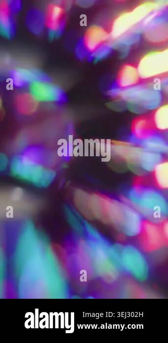 Vertical video. Spectrum light bokeh. Circular glow. Rainbow color ...