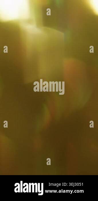 Vertical video. Blur crystal lens. Rainbow ray. Colorful light glow on ...