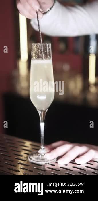 Vertical video. Barman working. Cocktail making. Unrecognizable man ...