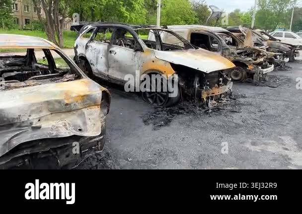Many burnt cars in the parking lot. Consequences of a fire due to a ...