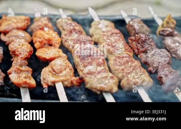 Juicy Uzbek shashlik and lula kebab of lamb, beef, and chicken smoking ...