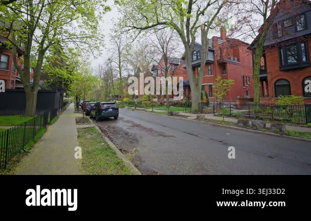 Elegant residential street with Victorian houses and fresh spring ...