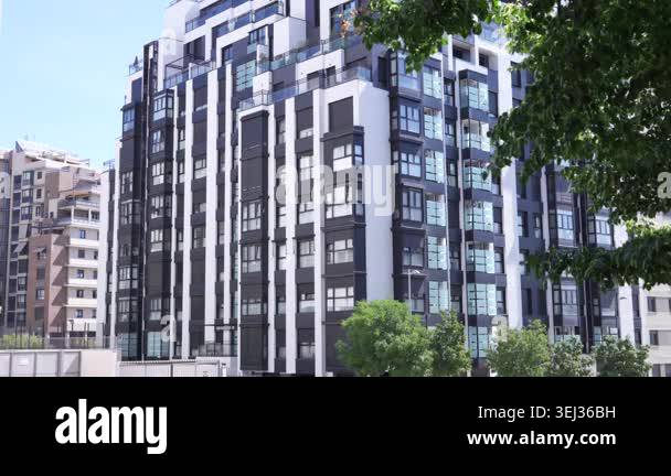 Contemporary residential apartment building with geometric black and ...