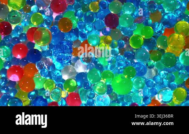 Colorful transparent water beads background with vibrant gel spheres ...