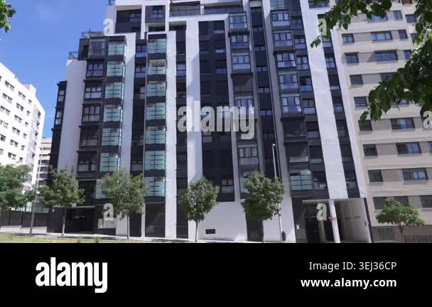 Contemporary residential apartment building with black and white facade ...