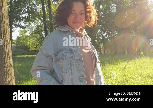 Beautiful young woman smiling laughing on sunset in city park. Outdoor ...