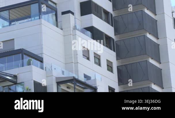Detailed view of a contemporary residential building facade with glass ...