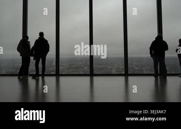 London, UK. October, 20, 2024, People in silhouette admiring the ...