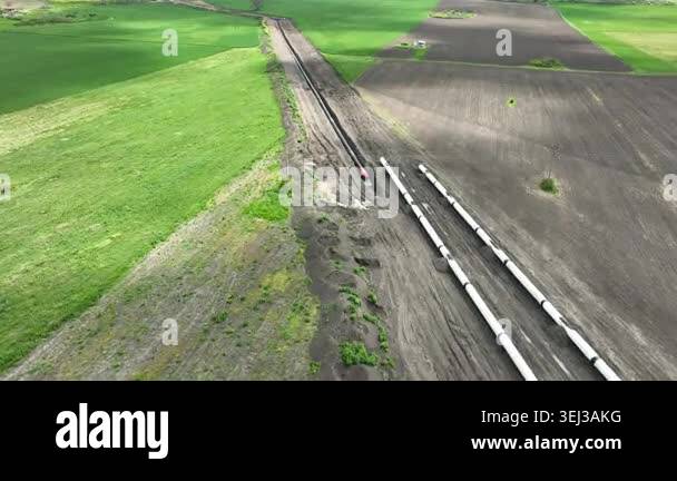 Aerial view of gas and oil pipeline construction. Pipes welded together ...