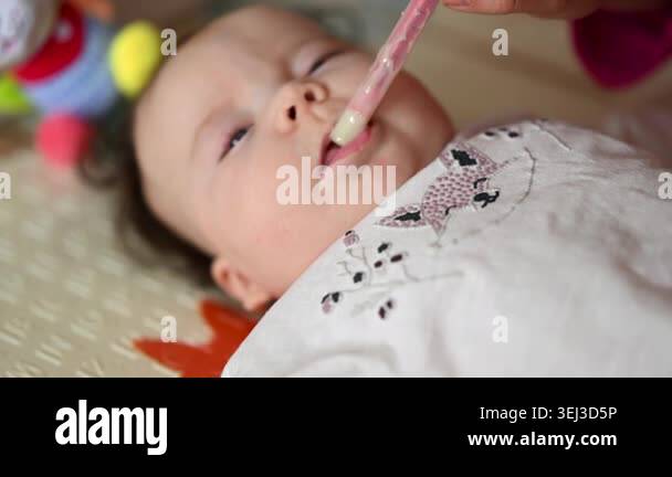 Detailed close up of a baby being fed with a syringe Stock Video ...