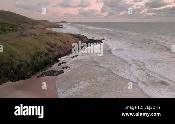 Sunrise drone footage of remote Australian beach with ocean waves. High ...