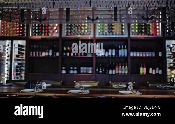 Restaurant interior shot featuring a wall filled with wine bottles ...