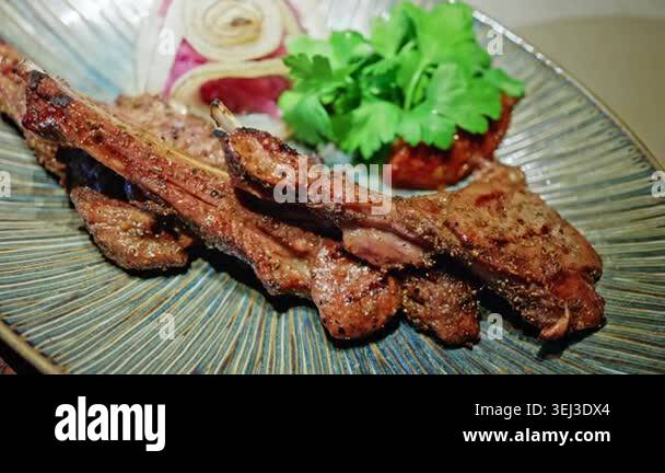 A plated dish of grilled meat served on a decorative plate, the dish is ...