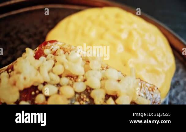 Close up of a pan seared white fish fillet with crispy skin, topped ...