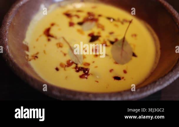 Person eating creamy soup with a spoon in a bowl Stock Video Footage ...