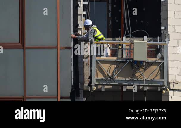 Chisinau, Moldova - April 5, 2026: A construction worker wearing a ...