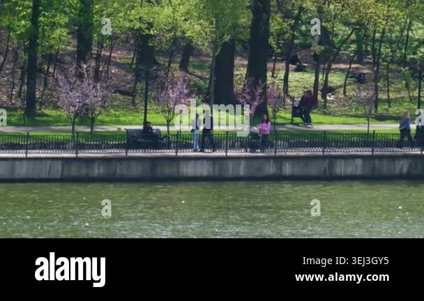 Chisinau, Moldova - April 16, 2026: People walking along a riverside ...