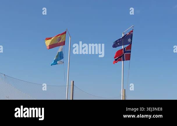 Spain, San Marino, Australia and Norway flag waving in the wind on ...