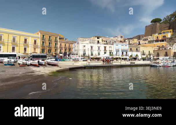 Scenic Lipari port with ancient Norman castle ruins atop lava rock ...