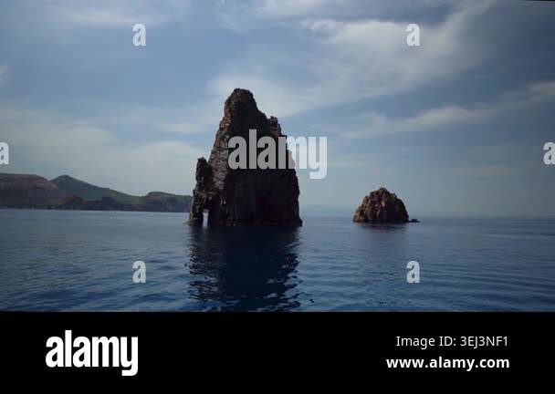 4K video of dramatic rocky sea stacks off the Sicilian coast, Italy ...