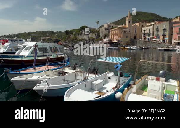 Lipari harbor with medieval citadel on volcanic rock, colorful ...