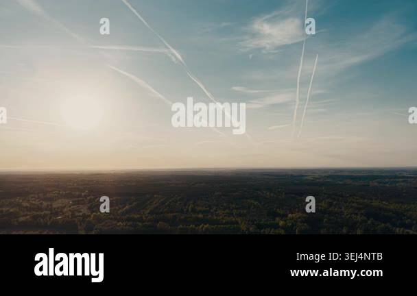Atmospheric display of light, clouds, and airplane lines Stock Video ...