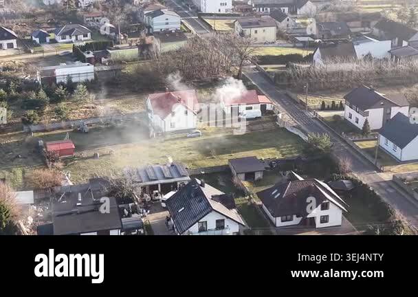 Modern house chimney emitting black smoke Stock Video Footage - Alamy