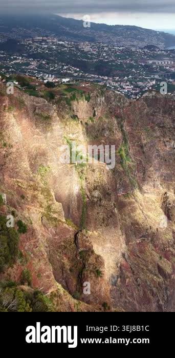 Daytime view displays the expansive Funchal city situated beneath the ...