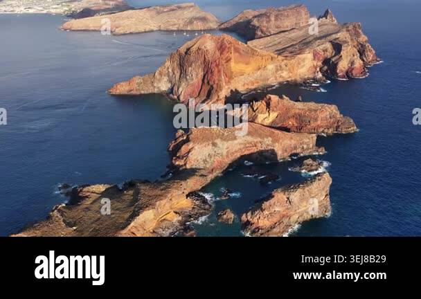 Fly over Madeira Portugals dramatic Ponta de Sao Lourenco. See rugged ...