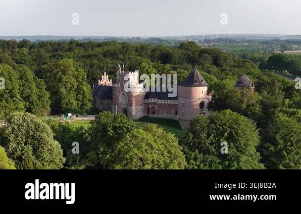 Fly over Gaasbeek Castle in Belgium showcasing its impressive ...