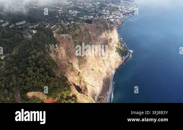 Aerial flight reveals stunning coastal cliffs dropping into the deep ...