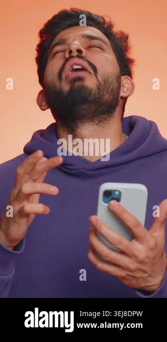 Indian man use mobile cell phone typing browsing, loses becoming ...