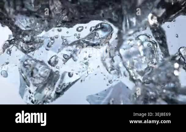 Super Slow Motion Shot of Clear Ice Cubes Falling into Water at 1000fps ...
