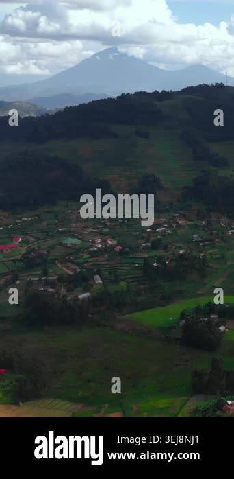 Cloudy Mountain Valley Town Aerial View, Sweeping Over Rooftops And ...